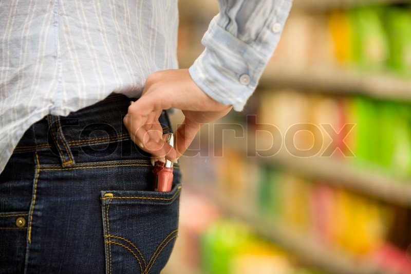 Theft of a young woman in a supermarket | Stock image | Colourbox