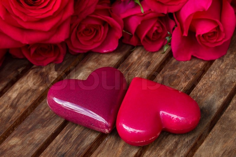 Pair of pink hearts with roses on ... | Stock image | Colourbox