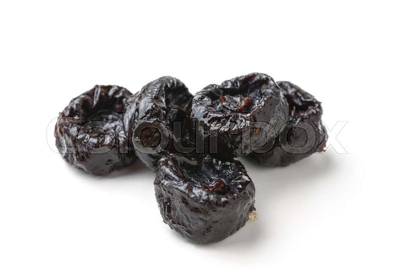 Sweet prunes isolated on white | Stock image | Colourbox