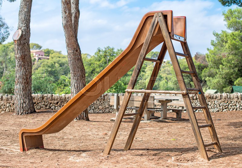 Wooden children's slide in the forest. | Stock image | Colourbox