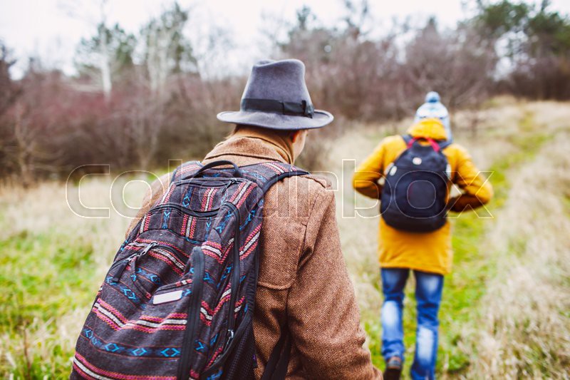 Hiker wearing hiking backpack and ... | Stock image | Colourbox