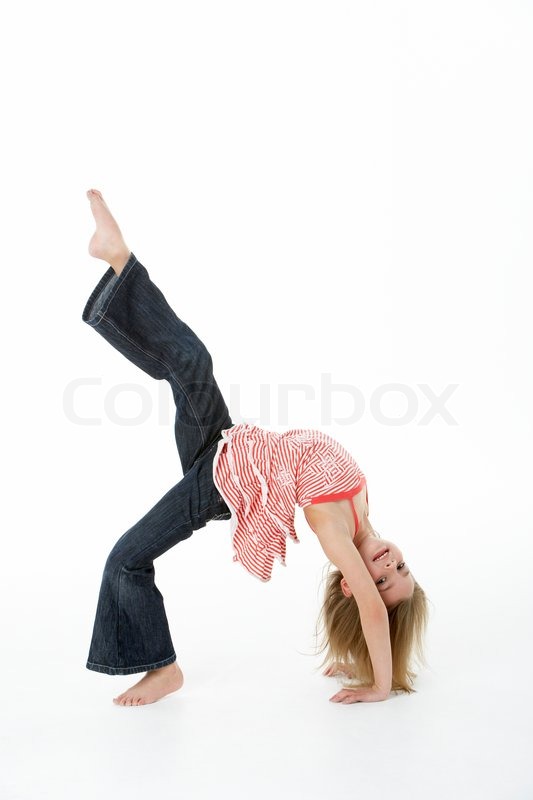 Young Girl Doing Backflip In Studio | Stock image | Colourbox