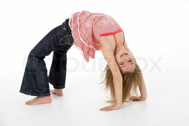 Young Girl Doing Backflip In Studio | Stock image | Colourbox