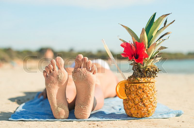 Woman with cocktail sunbathing on the ... | Stock image | Colourbox