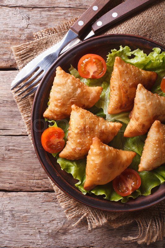 Delicious pastry samosas on a plate ... | Stock image | Colourbox