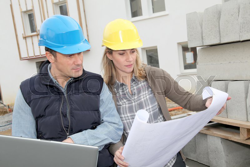 Architect and engineer looking at plan ... | Stock image | Colourbox