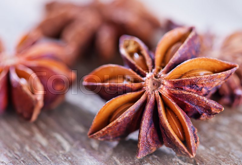 Dry anise on the wooden board, aroma ... | Stock image | Colourbox
