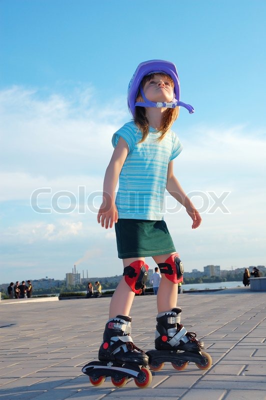 Four year old child rollerblading ... | Stock image | Colourbox