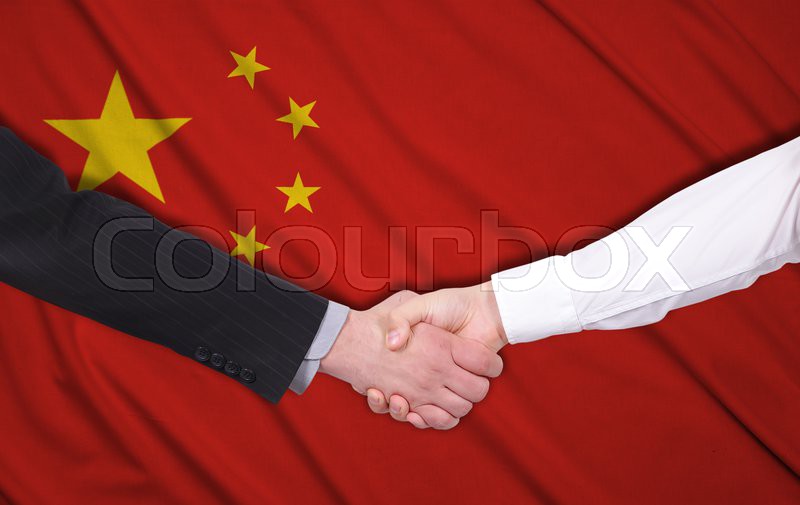Handshake on a china flag background | Stock image | Colourbox