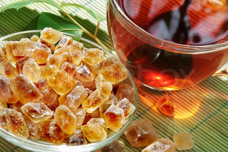 Eine Tasse Tee und brauner Zucker | Stock Bild | Colourbox