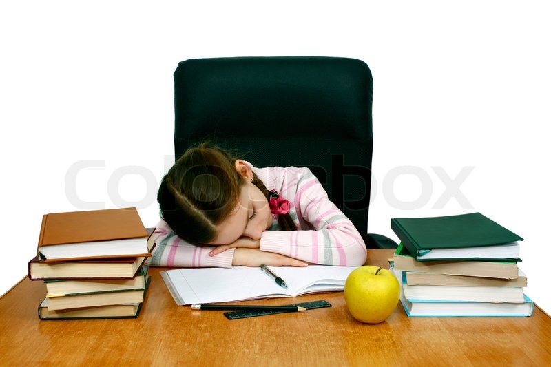 Girl is asleep at the writing table ... | Stock image | Colourbox