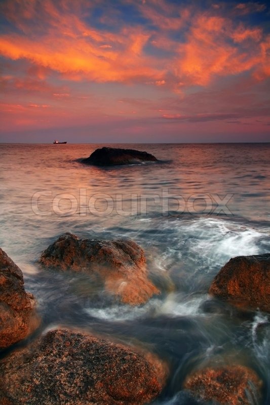 Calm sea at sunset on the ocean beach | Stock Photo | Colourbox