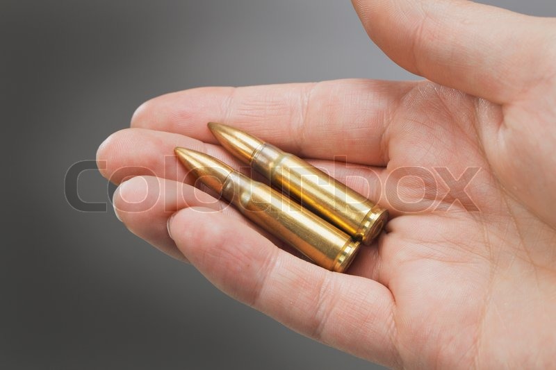 Assault rifle ammunition cartridges on ... | Stock image | Colourbox