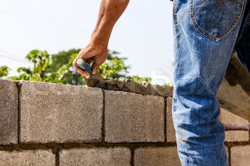 Construction mason worker install ... | Stock image | Colourbox