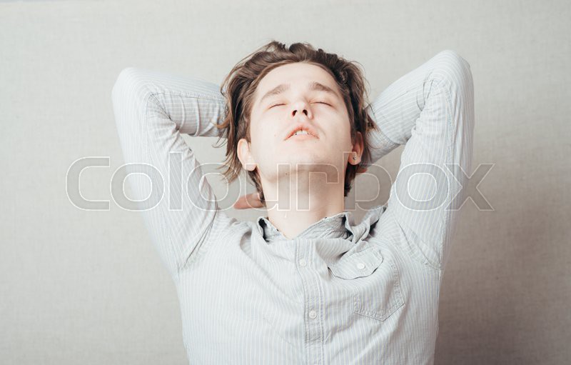Man leaned back in his chair | Stock image | Colourbox