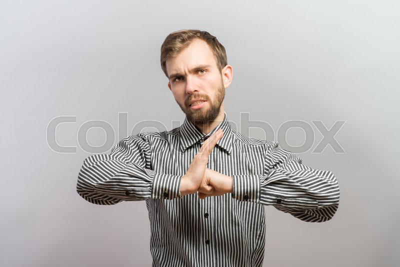 Young man angry gesturing fist raised ... | Stock image | Colourbox