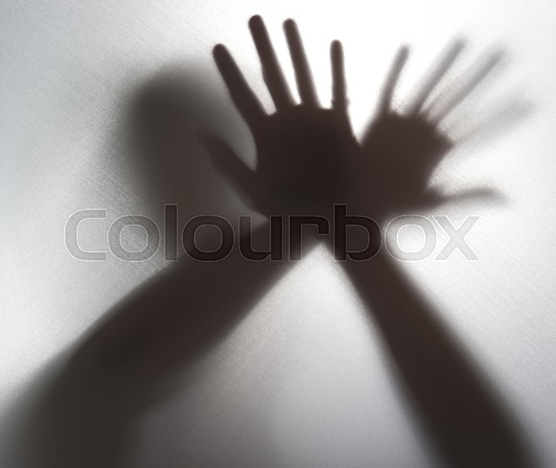 Silhouette of a hand in the back ... | Stock image | Colourbox