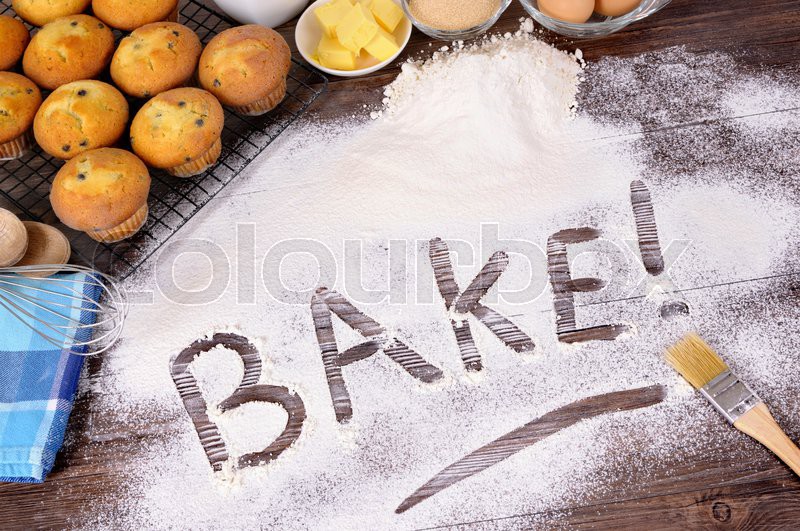The word Bake written in flour on a ... | Stock image | Colourbox