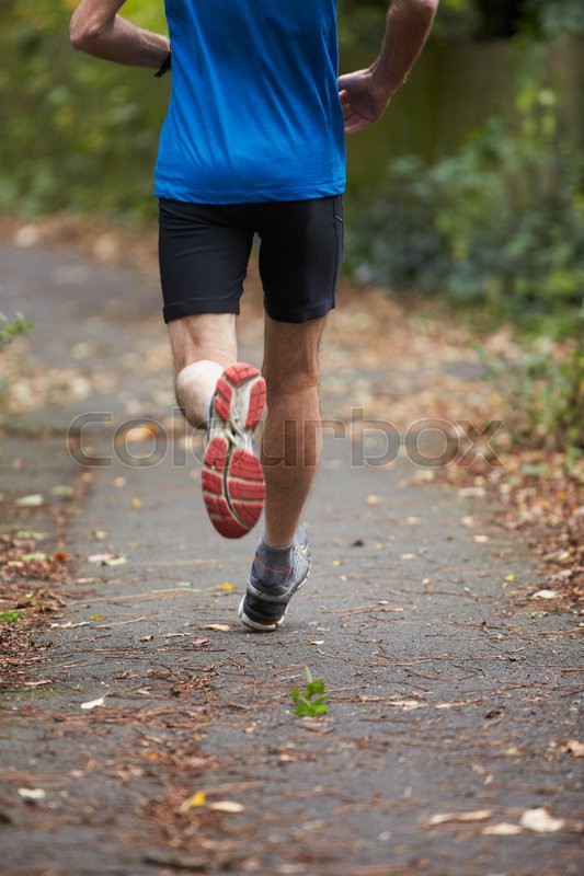 Close Up Of Jogger's Feet Running On ... | Stock image | Colourbox