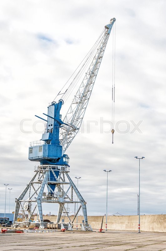 Harbor crane on rails in port. | Stock image | Colourbox