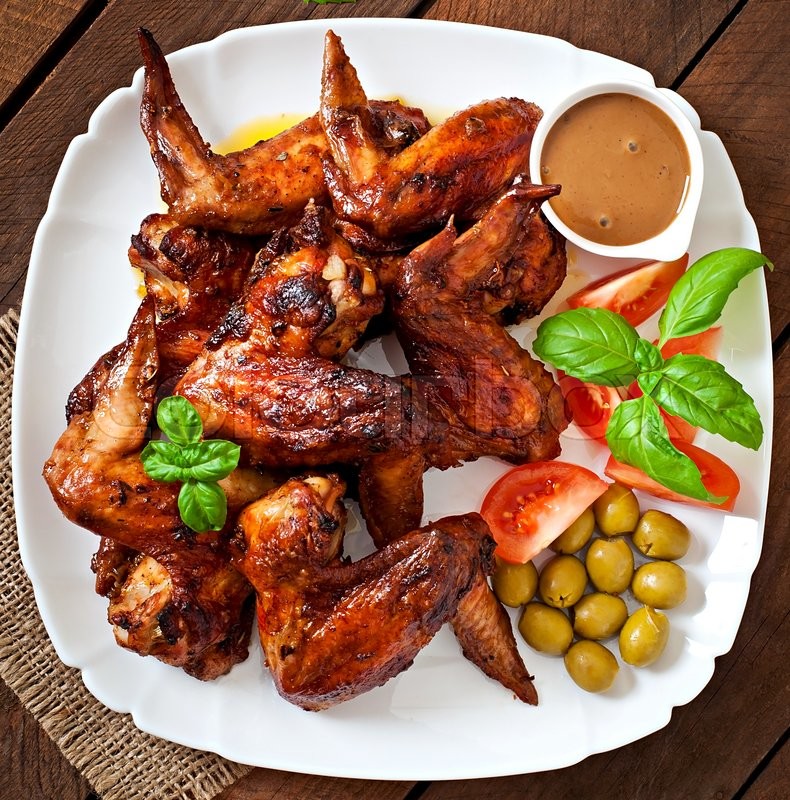 Plate of chicken wings on wooden ... | Stock image | Colourbox