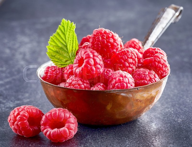 Bowl of fresh organic raspberries | Stock image | Colourbox