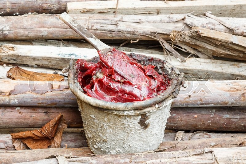 Close up dirty grease and wooden paddle ... | Stock image | Colourbox