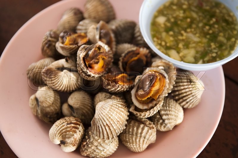 Boiled cockles and spicy sea food sauce ... | Stock image | Colourbox