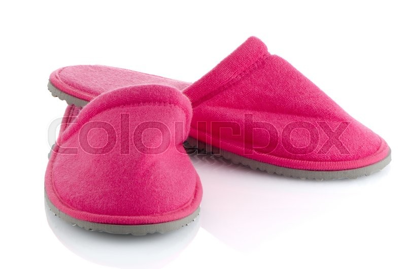 A pair of pink slippers on a white ... | Stock image | Colourbox
