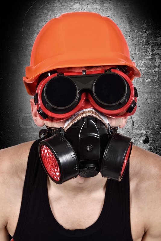 Worker in biohazard mask on black ... | Stock image | Colourbox