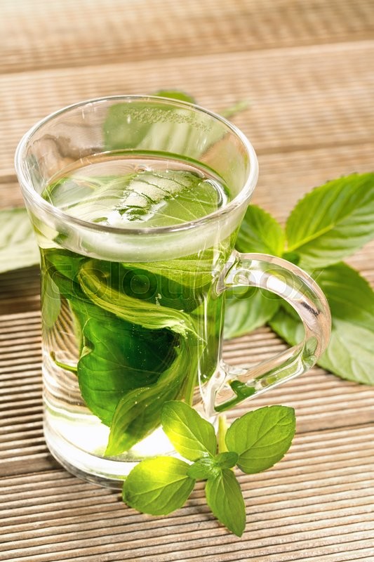 Mint tea with fresh mint leaves on a ... | Stock image | Colourbox