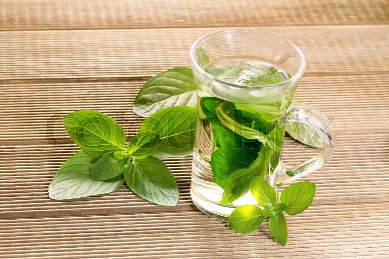 Mint tea with fresh mint leaves on a ... | Stock image | Colourbox