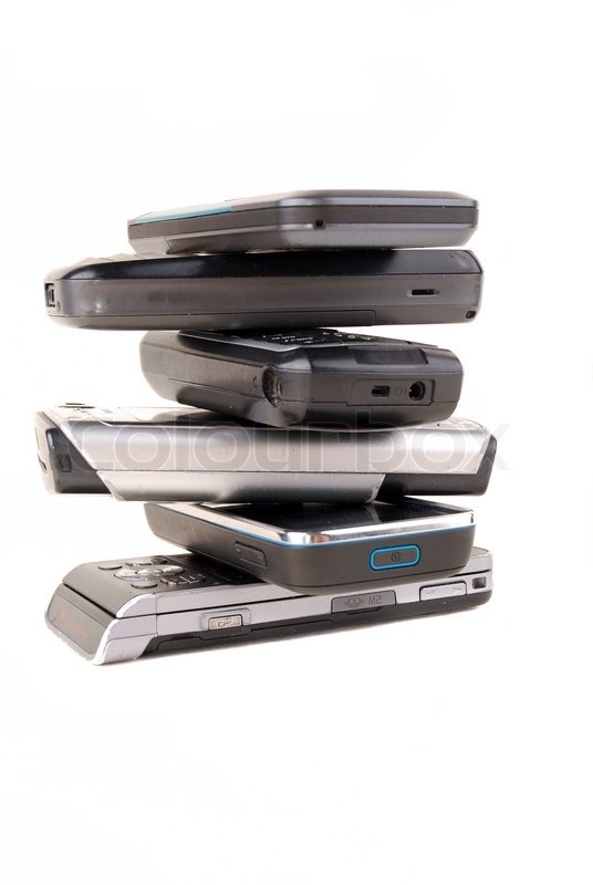 Heap of mobile phones isolated on white ... | Stock image | Colourbox