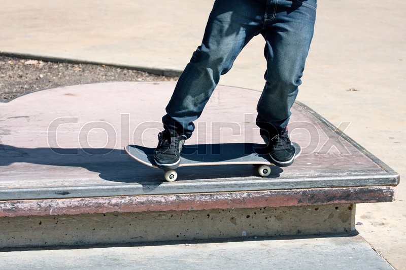 Close up of a skateboarders feet while ... | Stock image | Colourbox