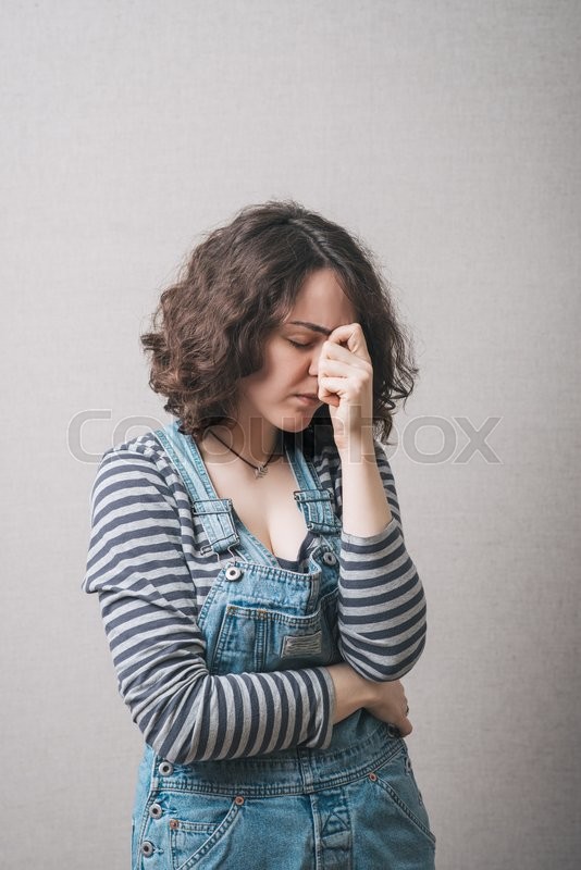 Woman sad, saddened, bowed her head. ... | Stock image | Colourbox