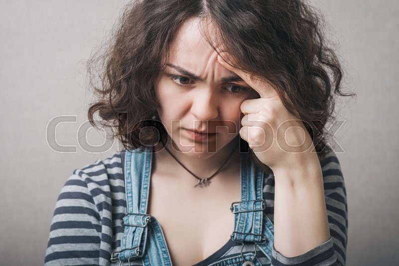 Woman sad, saddened, bowed her head. ... | Stock image | Colourbox