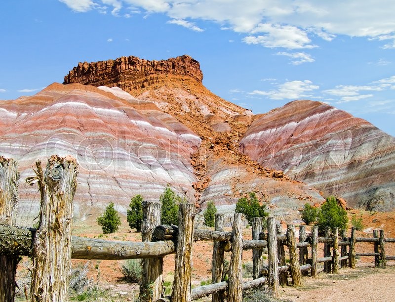 Vividly colorful striated cliffs rise ... | Stock image | Colourbox