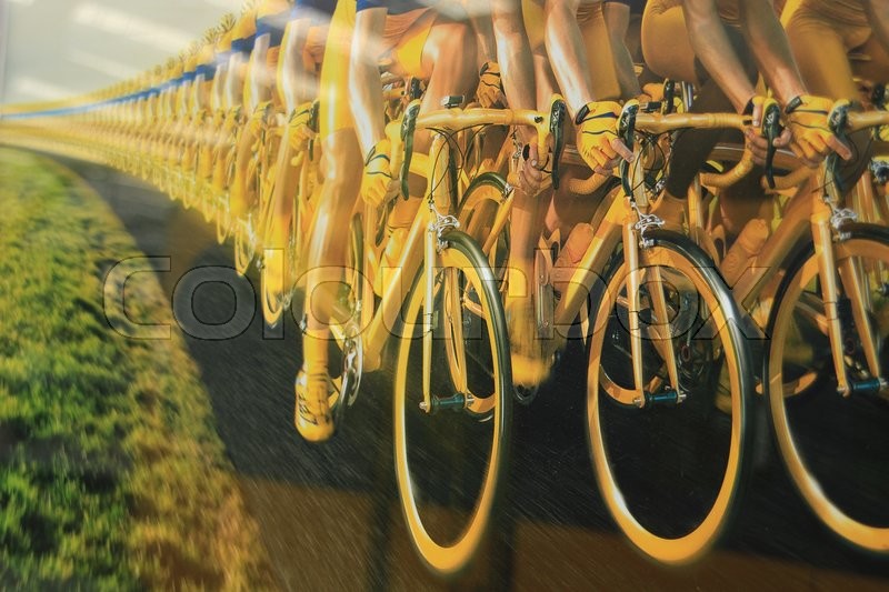 Group of cyclers on the way in yellow ... | Stock image | Colourbox