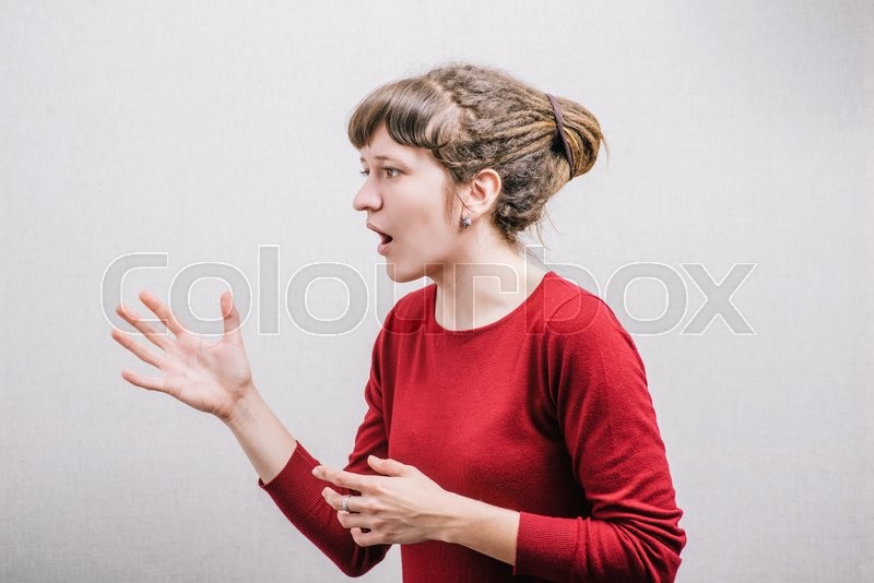 Woman scolding, indignant, profile. On ... | Stock image | Colourbox
