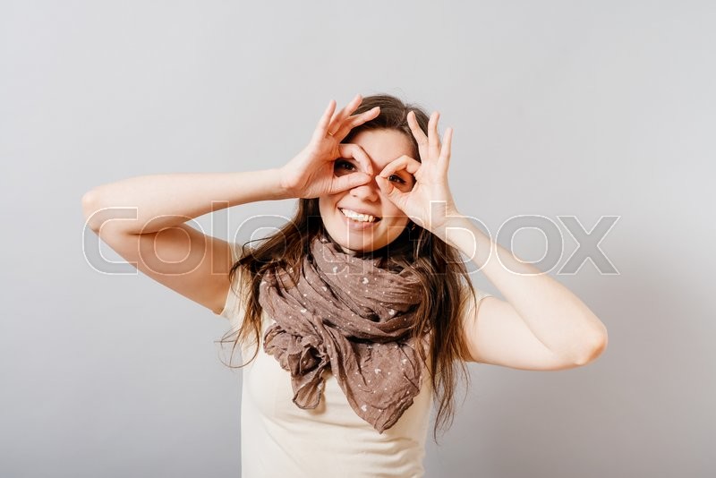 Young woman looking into the camera ... | Stock image | Colourbox