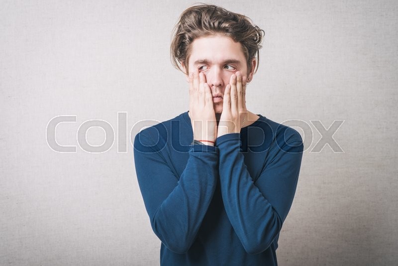 The man pulls the skin under the eyes. ... | Stock Photo | Colourbox