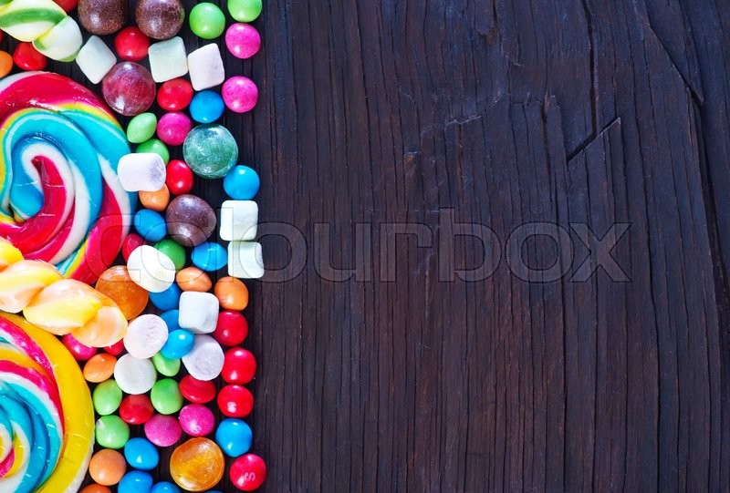 Sweet color candy on the wooden ... | Stock image | Colourbox
