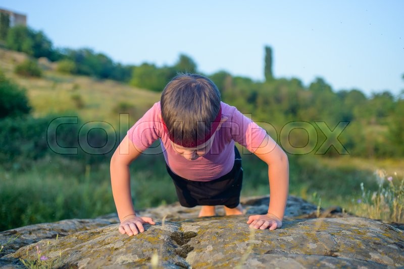 Sporty Young Boy Doing Push up Exercise ... | Stock image | Colourbox