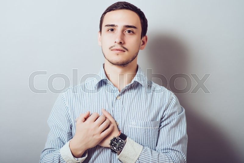 The man put his hands on his chest, the ... | Stock image | Colourbox