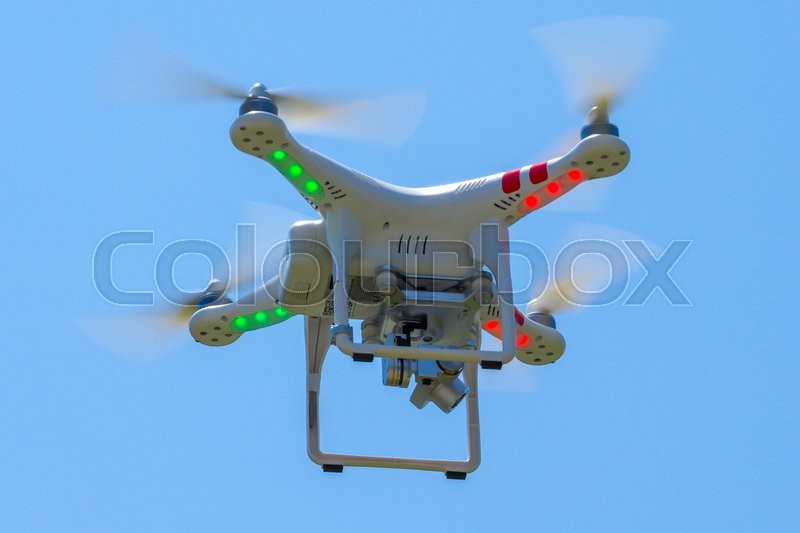 Bottom view of a drone flying with a ... | Stock image | Colourbox