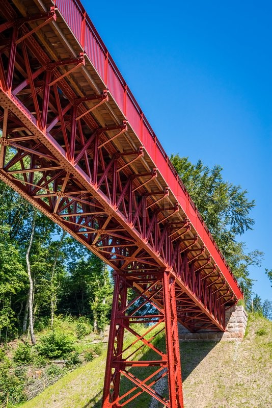 Old red metal bridge in perspective in ... | Stock image | Colourbox