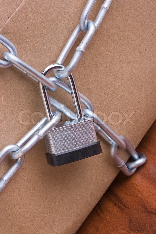 Metal lock and chain on a brown ... | Stock image | Colourbox
