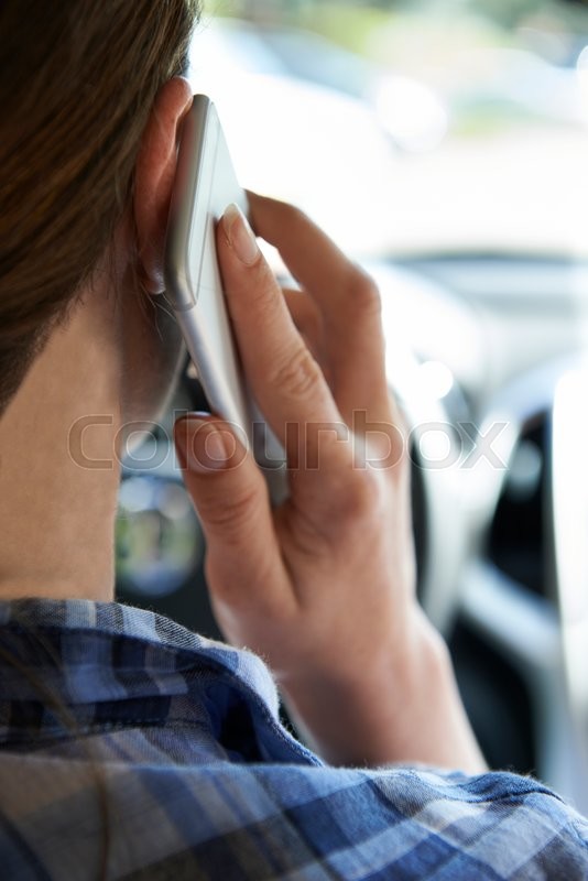 Woman In Car Talking On Mobile Phone ... | Stock image | Colourbox