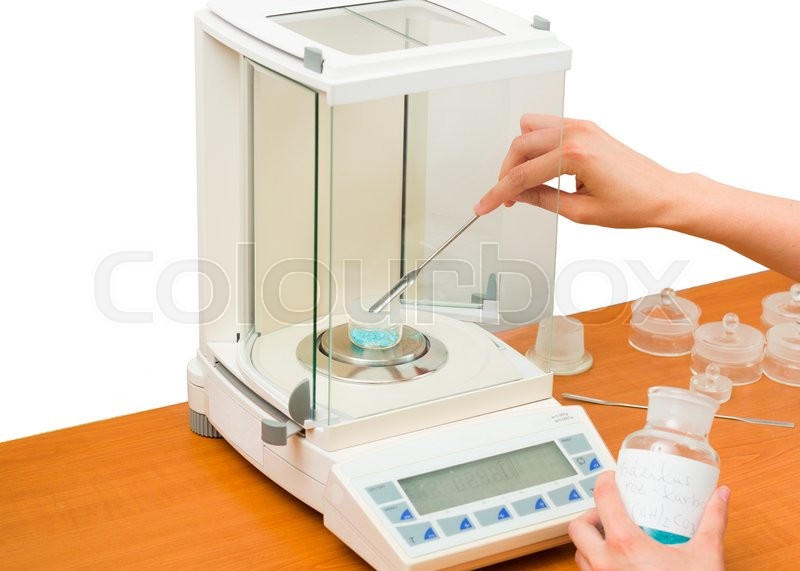 Pharmacist measuring active substance ... | Stock Photo | Colourbox
