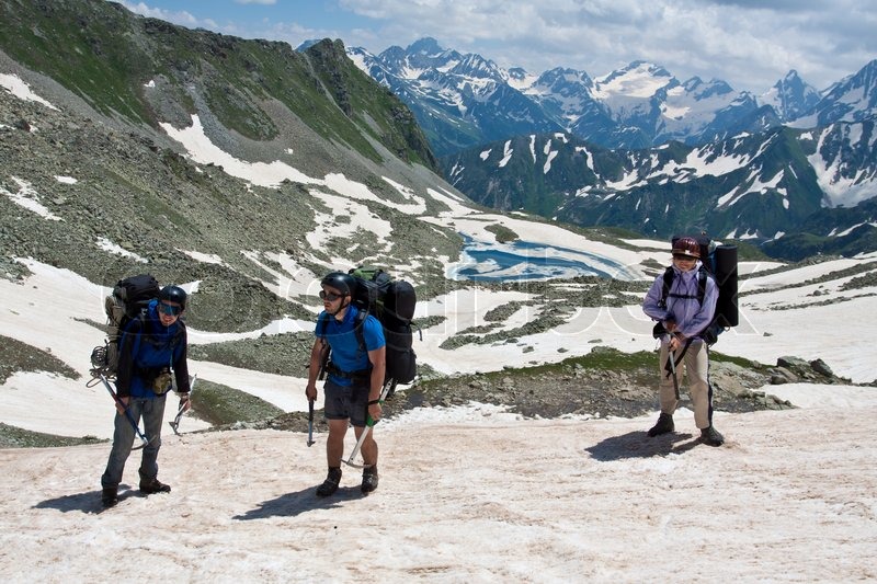 Three hikers friends standing on the ... | Stock image | Colourbox